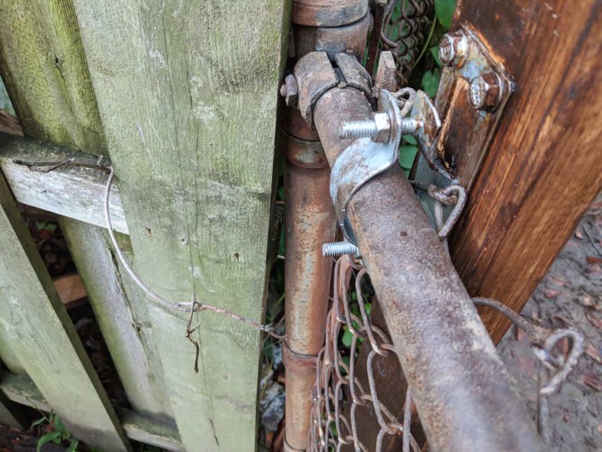 Attaching a wood fence to a chainlink fence | And Then We Tried